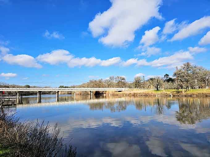 Perfect reflections double the scenery where the fishing dock meets water so still it looks like glass.
