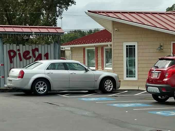 The simple cream-colored building with red lettering proves that great seafood doesn't need fancy packaging to shine bright.