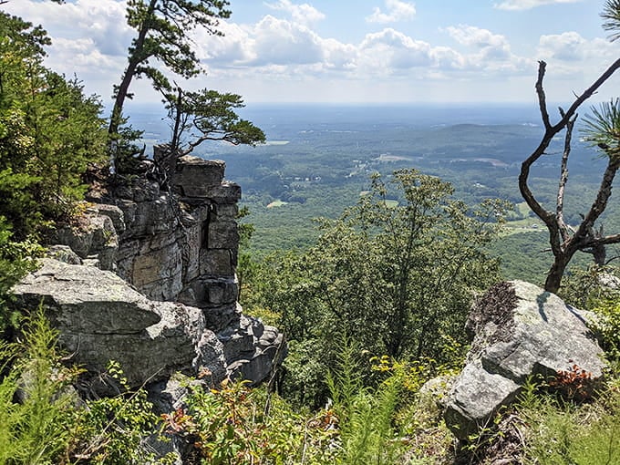 Rocky outcrops frame endless views across rolling hills, stretching toward horizons that make you understand why people write poetry.