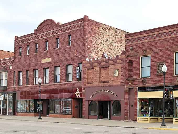 This Art Deco gem curves gracefully on the corner like a vintage jukebox that decided to become architecture.