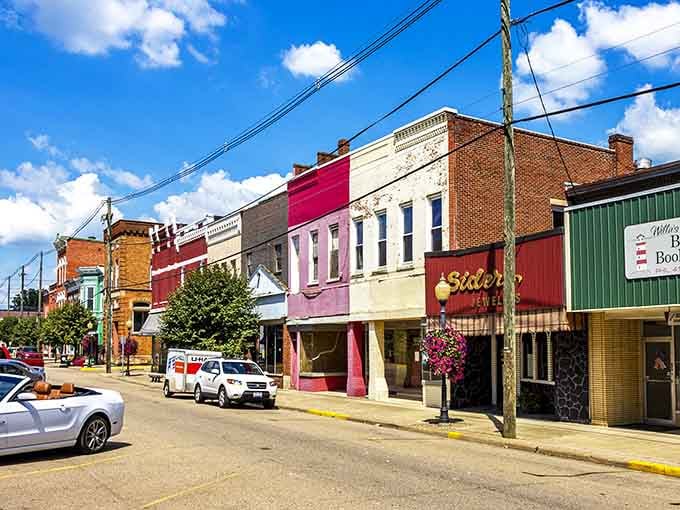 Point Pleasant's colorful Main Street showcases vibrant storefronts with eye-catching pink and red buildings, perfect for a wallet-friendly shopping adventure.