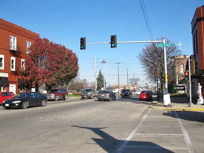 Autumn trees frame the intersection where small-town life continues at a pace that lets you actually enjoy each moment fully.