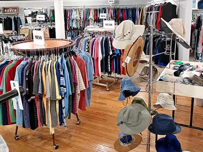 Wooden floors and organized racks create a boutique atmosphere where vintage finds meet contemporary style seamlessly together.