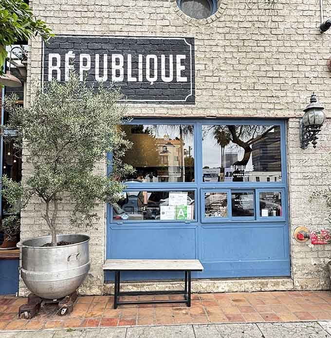 That powder-blue storefront radiates Parisian charm, making you want to practice your French before ordering pastries.