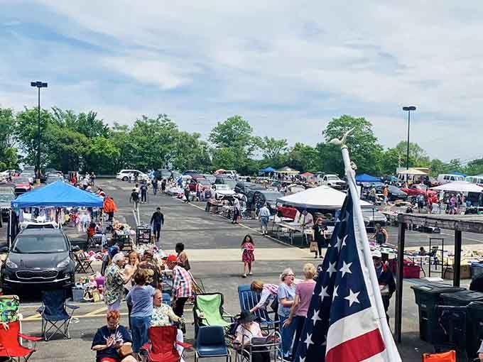 The American flag waves proudly over this patriotic gathering where neighbors become friends while hunting for bargains together.
