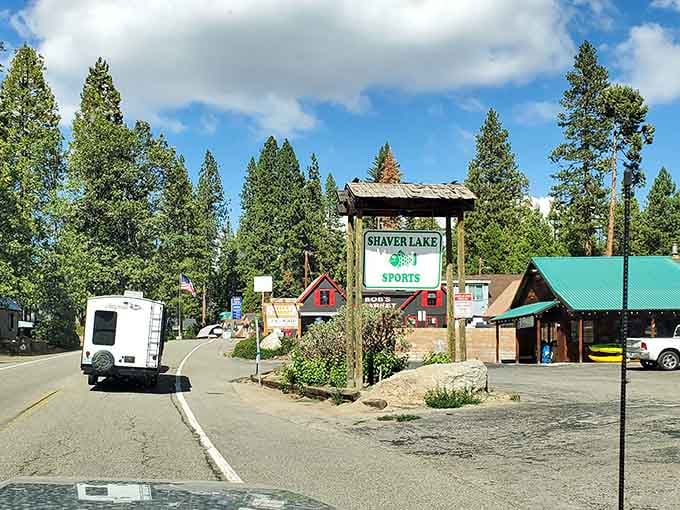 That rustic welcome sign promises exactly what you hope for: a genuine mountain community untouched by corporate sprawl.