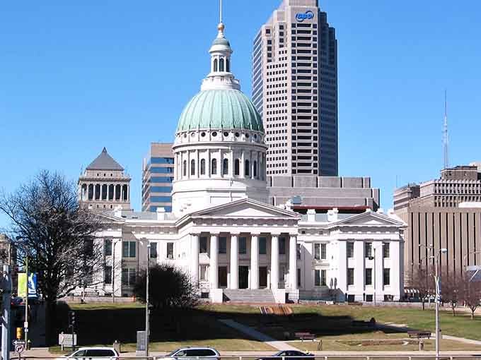 The Old Courthouse stands gleaming white against modern towers, showing how history and progress can coexist quite beautifully together.