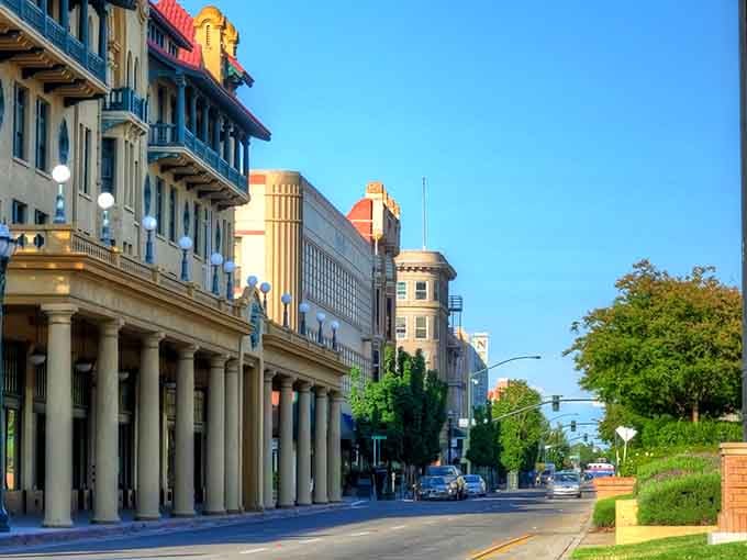 Classical columns march along the street like sentries guarding the city's architectural heritage and community pride.