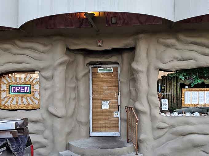 That sculpted rock entrance makes you wonder if Fred Flintstone moonlights as a restaurant designer these days.