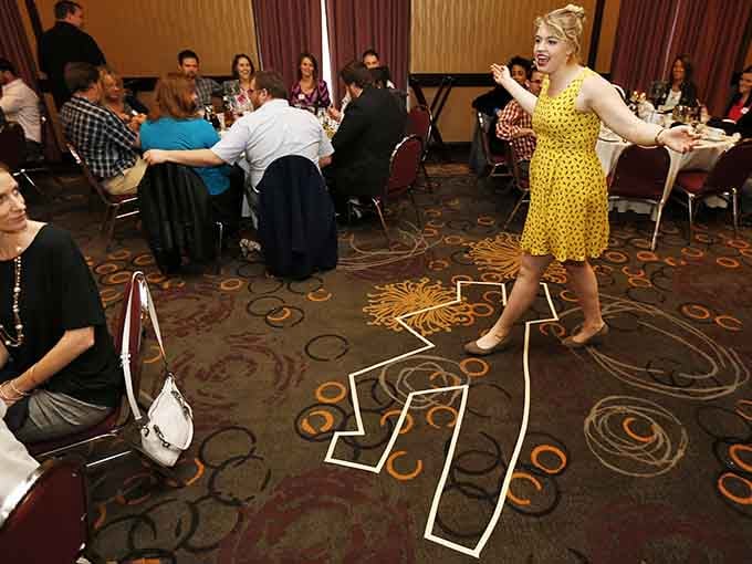 A 1940s-style dame in yellow polka dots brings theatrical flair to this interactive whodunit where everyone's a suspect.