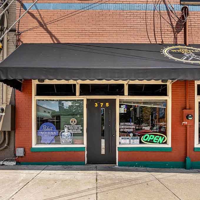 The classic black awning and brick facade promise no-nonsense food served with genuine neighborhood hospitality.