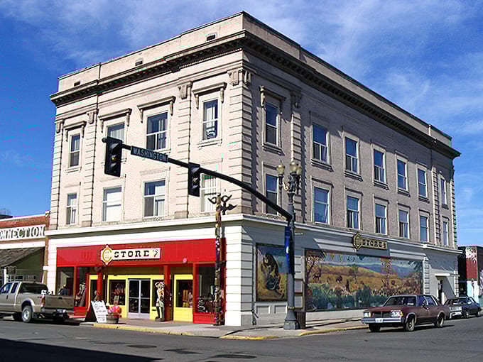 That corner building's bright red storefront pops against historic architecture like a cherry on a sundae from yesteryear.
