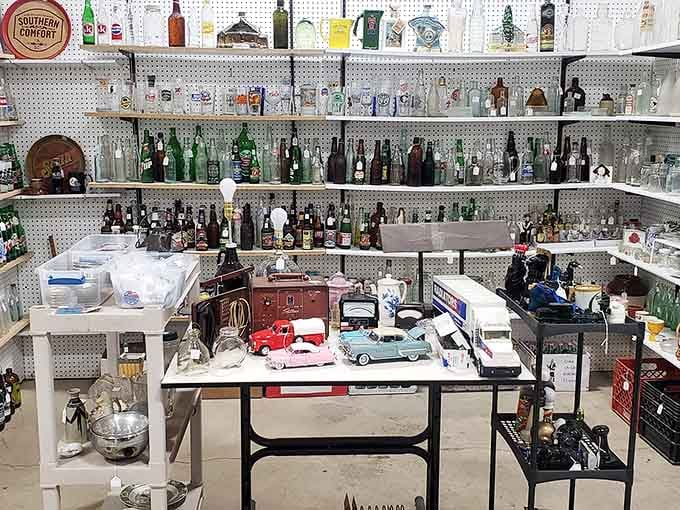 Vintage bottles line pegboard shelves like soldiers standing at attention, each one holding memories of simpler times gone by.