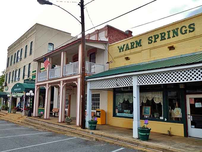 Those cheerful storefronts practically beg you to stop in, especially when that "Warm Springs" sign promises small-town hospitality.