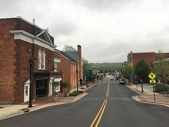 Main Street slopes gently toward distant mountains, creating views that remind you why small-town living feeds the soul daily.