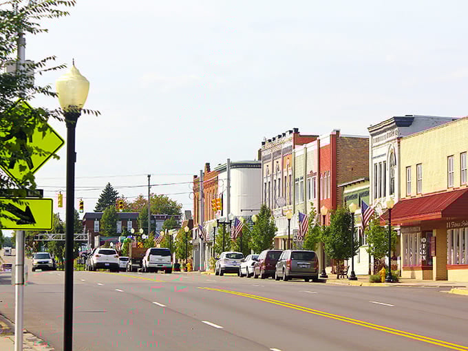 Patriotic bunting and colorful storefronts line this downtown street, inviting you to park and explore at your leisure.