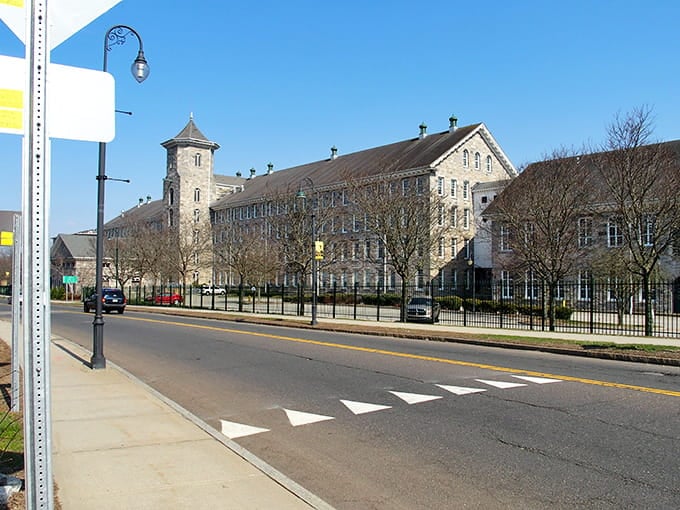 The impressive brick complex stretches along the street, its tower standing proud as a testament to industrial heritage.