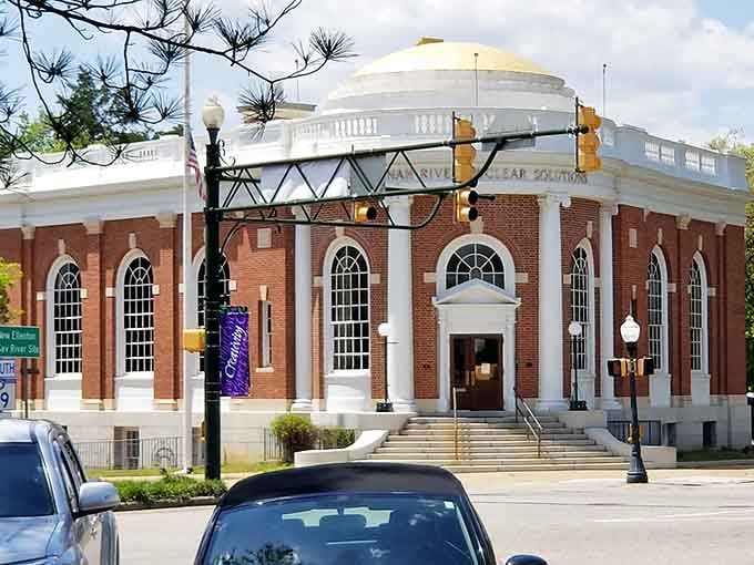 Neoclassical grandeur rises from brick and stone, a temple to culture in the heart of town.