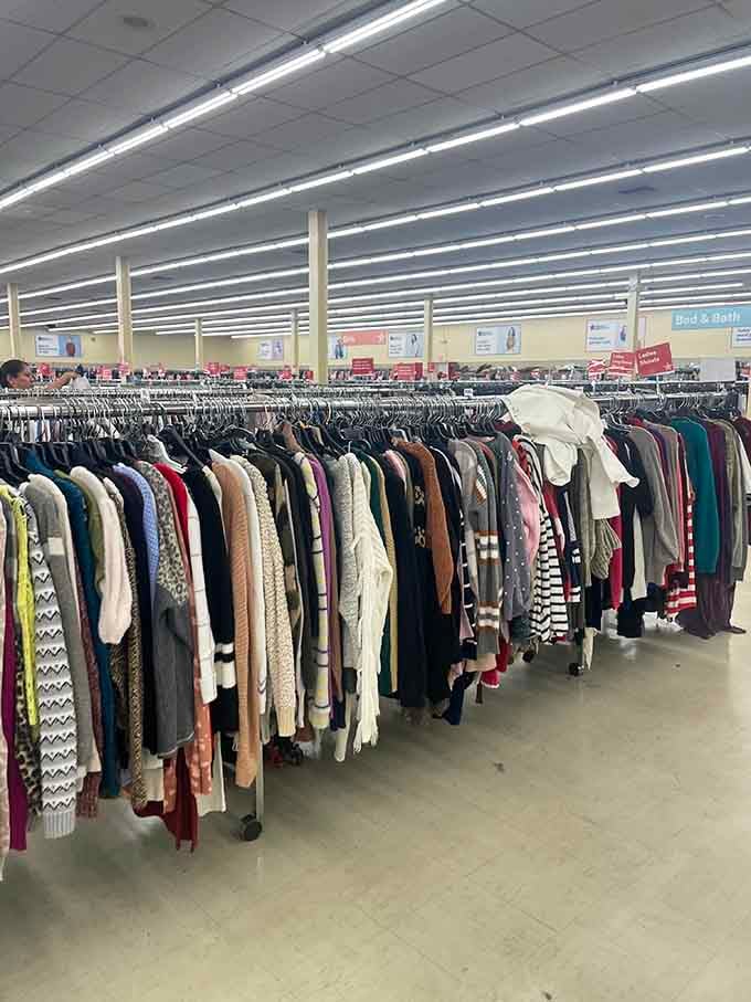 Endless clothing racks disappear into the distance, proving that one person's closet cleanout is another's wardrobe jackpot.