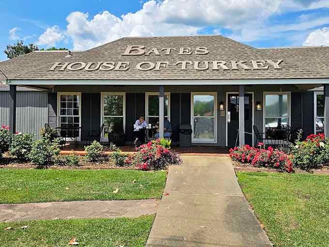Colorful flower beds frame the entrance where turkey takes center stage every single day of the year.