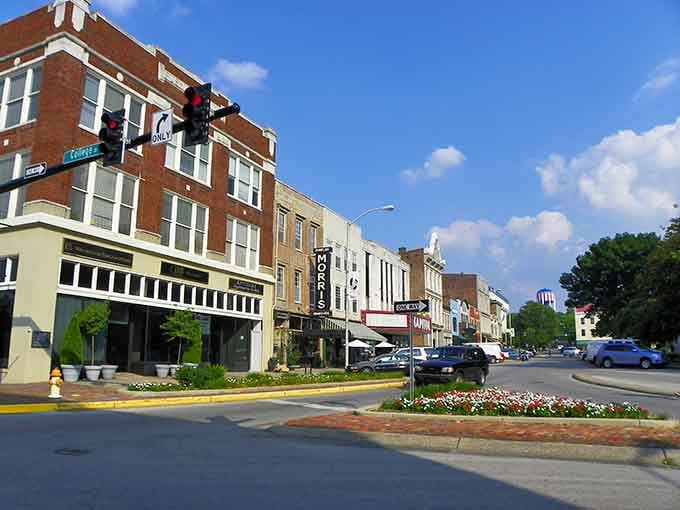 Flower beds brighten the median like nature's welcome mat, proving small cities still care about curb appeal and community pride.