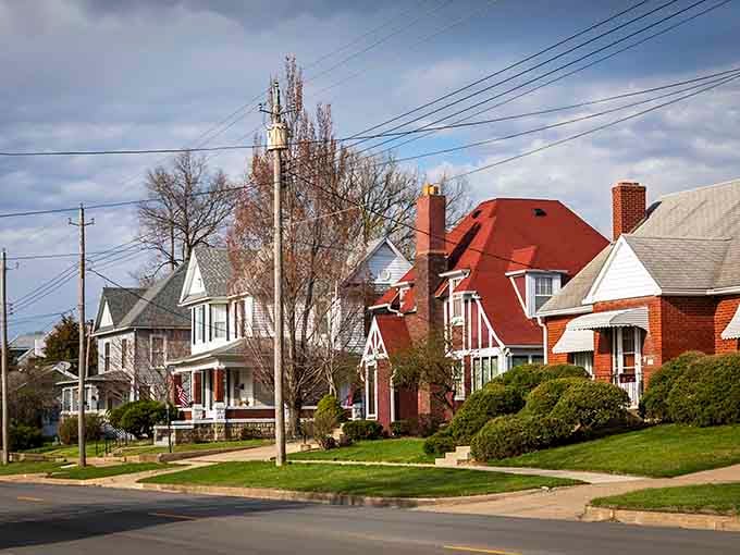 Well-kept homes with manicured lawns line peaceful streets where neighbors still sit on porches and wave at passing cars.