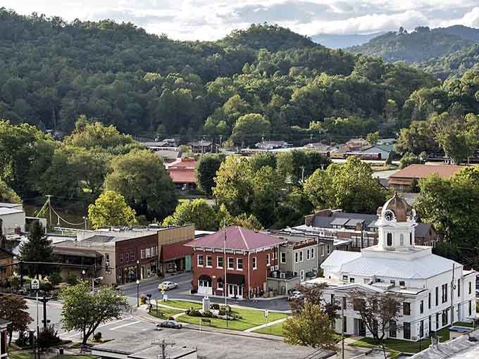 Nestled among the trees, historic buildings create a picturesque town waiting to be explored.