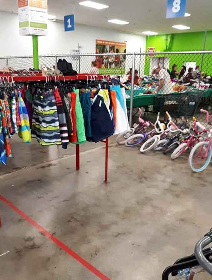 Rows of colorful clothes and bikes fill the space like a rainbow of second-chance treasures for families.