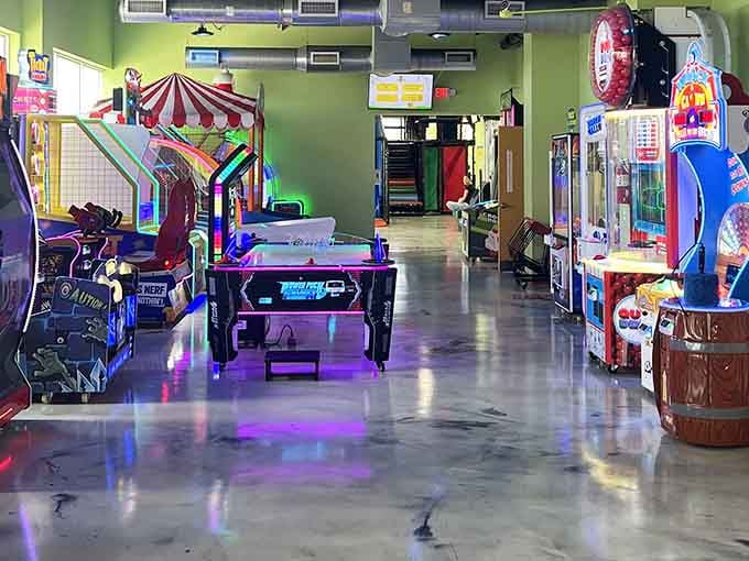 Rows of games stretch into the distance like a carnival midway that never closes, rain or shine.