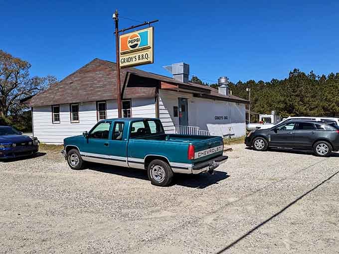The white building sits solid and unassuming, letting the barbecue smoke do all the talking it needs to do.