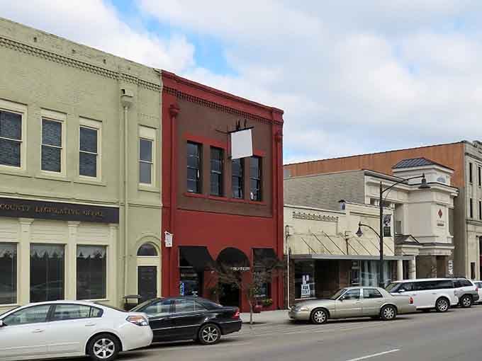 Pastel buildings stand shoulder-to-shoulder like old friends sharing secrets across the decades of small-town life.