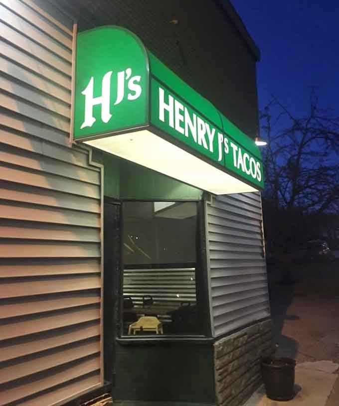 Night or day, that glowing sign beckons taco lovers to a tiny building with enormous flavors waiting inside.