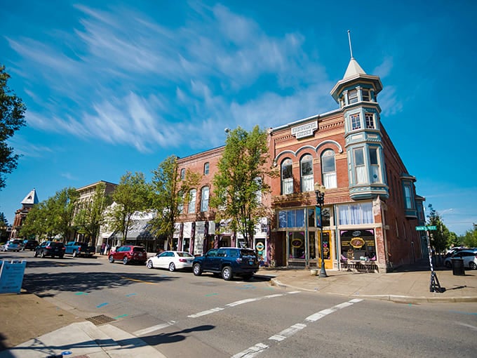 Sunlight illuminates brick facades and that stunning turret, showcasing details modern construction simply doesn't bother with.