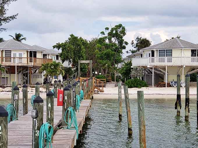 Private docks stretch into crystal-clear water where boats bob gently beside stilt houses built for island living.