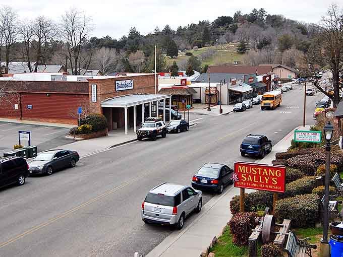 Julian's historic downtown stretches along the main road, with Mustang Sally's sign inviting visitors to explore this mountain getaway.