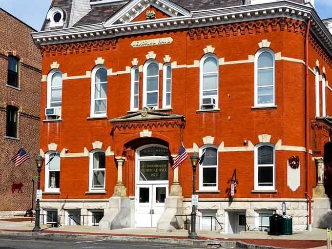 This orange brick building with white trim looks like it's been standing guard over Main Street since Teddy Roosevelt was president.