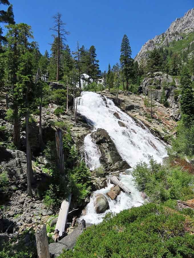 Surrounded by towering peaks and pine trees, this waterfall puts on a show that rivals any theater production downtown.
