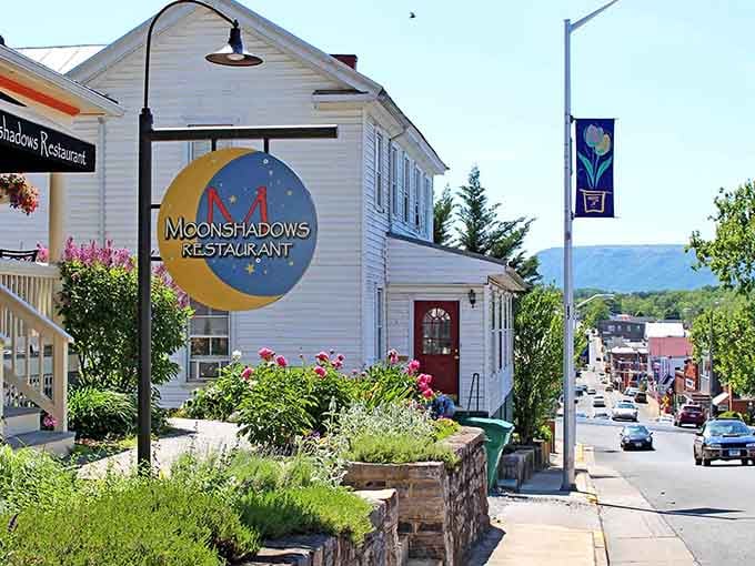 The Moonshadows sign beckons hungry travelers with promises of good food and mountain views from this hillside perch.