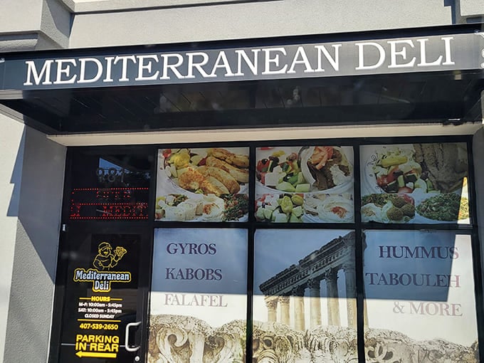 The window display at Mediterranean Deli offers a tempting preview of the Greek and Middle Eastern treasures waiting inside.