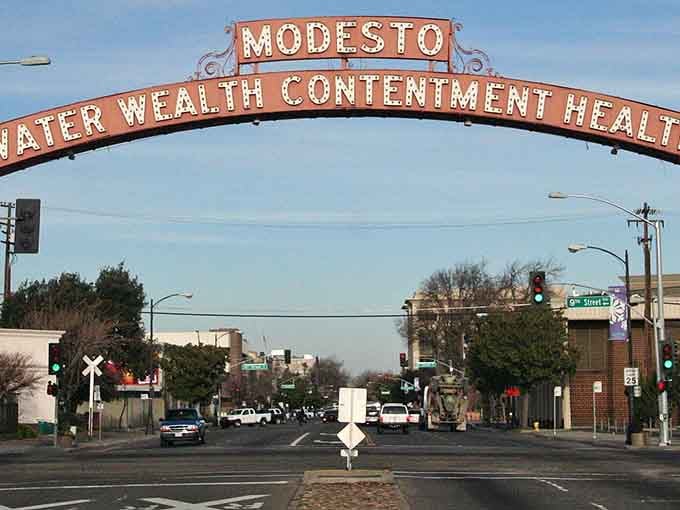 Modesto's iconic arch welcomes visitors with promises of water, wealth, contentment, and health—plus rent under two grand monthly.