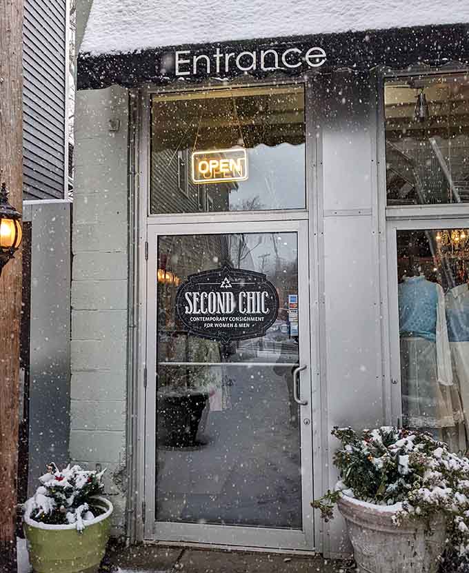 That glowing "OPEN" sign beckons through the snowy evening, promising warm discoveries inside this contemporary consignment treasure trove.
