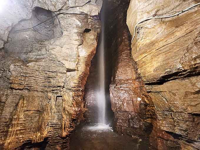 That underground waterfall cascades 100 feet down through ancient rock like nature's own secret fountain show.