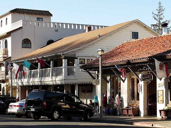 White stucco and red tile roofs line the street like a Spanish mission decided to become a neighborhood.