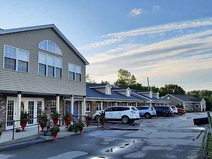 Dusk brings painted skies and peaceful streets, where local shops close up as neighbors head home.