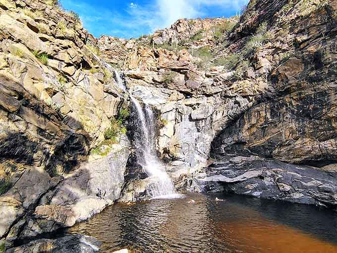 The rugged canyon setting makes this seasonal cascade feel like discovering a cowboy's secret watering hole.