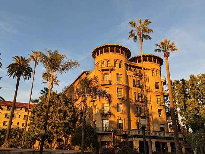 Arched windows and yellow walls glowing at sunset transform this elegant building into pure architectural poetry from another era.