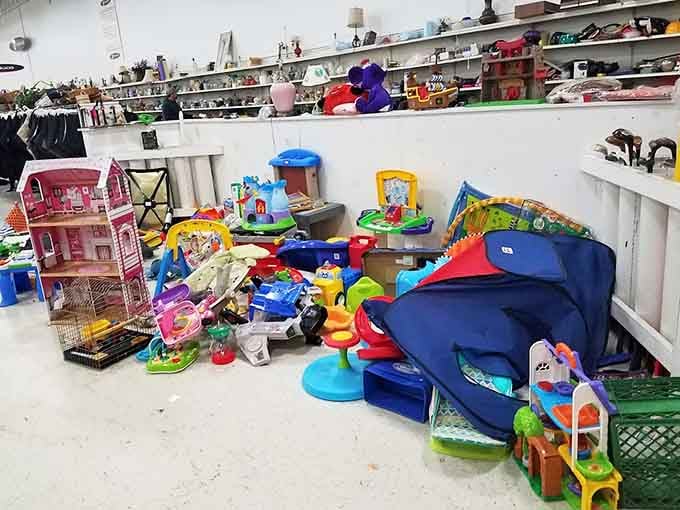 The colorful chaos of toys piled high reminds you that one family's outgrown treasures become another's cherished finds.