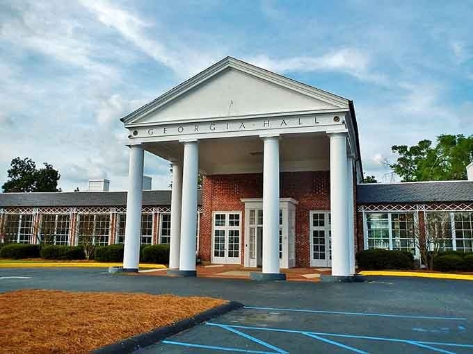 Classical columns announce this entrance with Southern grandeur, where architecture speaks louder than any welcome sign could.