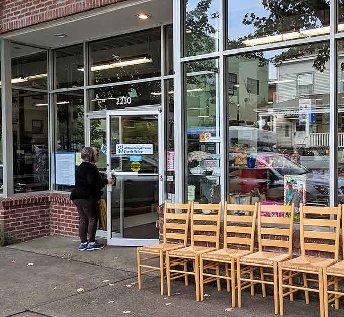 Those wooden chairs lined up outside are already finding new homes before they even make it to the sales floor.