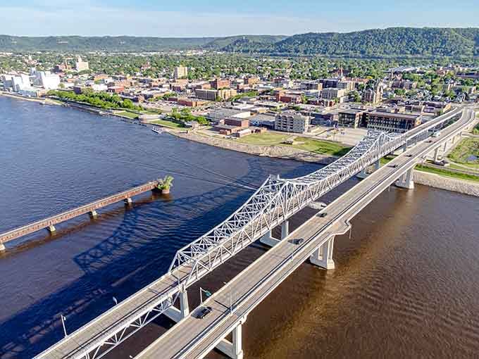 That bridge spanning the water connects more than states—it links past and present with graceful steel arches.